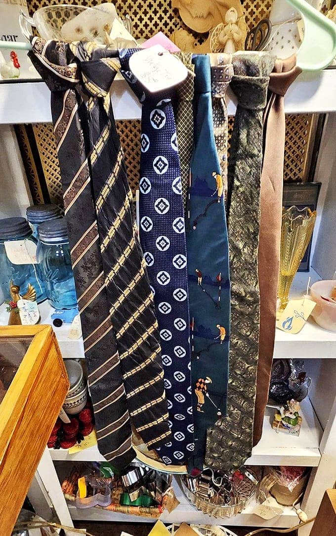 The necktie wall chronicles decades of men's fashion – from conservative stripes to whimsical patterns that reveal personality one narrow fabric strip at a time.