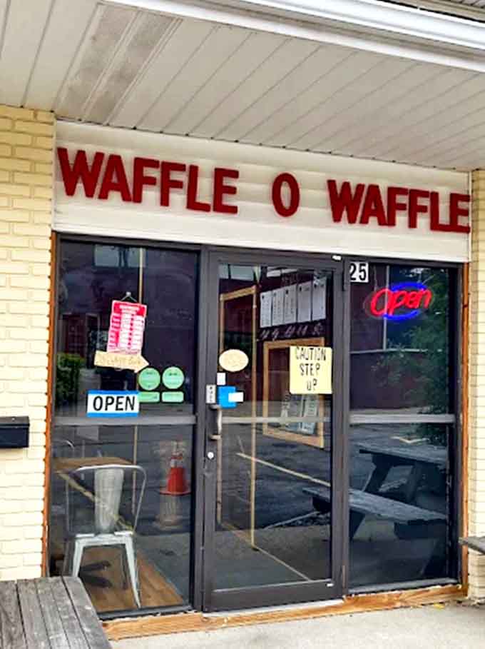 Entrance: The welcoming doorway practically whispers, "Come in, hungry traveler, and prepare for waffle enlightenment" with its humble charm.