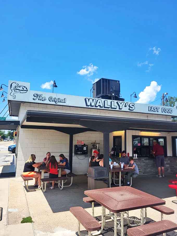 Families and friends gathering at picnic tables: this is what community looks like, one burger at a time.