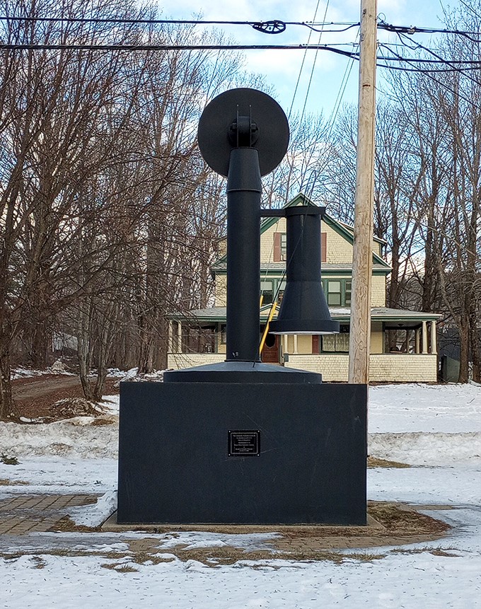 Winter transforms the World's Largest Telephone into a snow-dusted monument, standing stoic against Maine's chilly embrace like a communication sentinel.