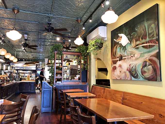 Colorful artwork and cozy seating create the kind of space where conversations flow as freely as the coffee.