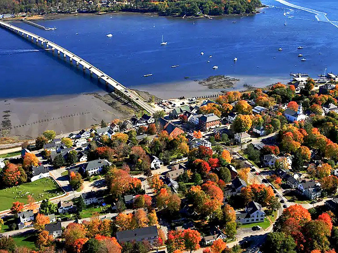Aerial view showcasing Wiscasset's perfect positioning along the Sheepscot River &ndash; nature and architecture in harmonious New England matrimony.