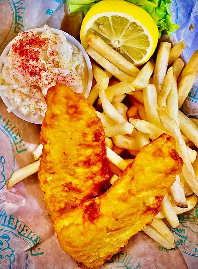 Fish so perfectly golden and crisp, it makes you wonder if it was battered by someone with an art degree and a deep respect for marine life.