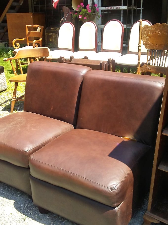 Vintage leather chairs invite weary shoppers to imagine them in a cozy reading nook, paired with a good book and better whiskey.