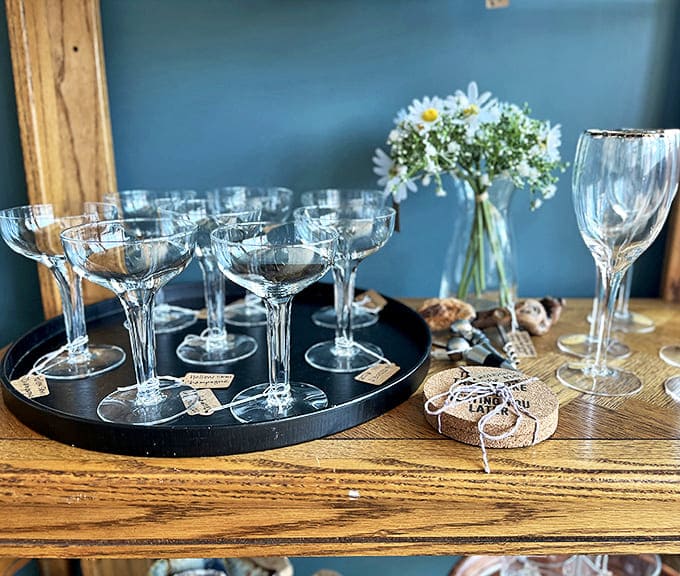 Crystal champagne coupes that have toasted countless celebrations stand ready for your next special occasion. Gatsby would approve of these elegant vessels.