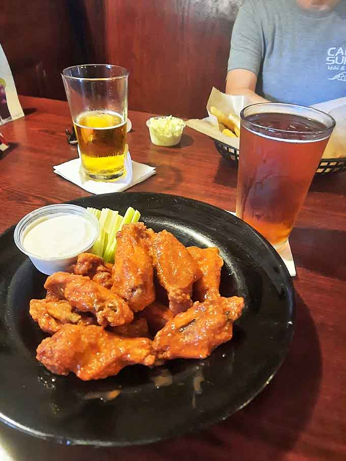 Buffalo wings glisten with sauce, ready to be dunked in cooling ranch dressing &ndash; a perfect match for cold beer.