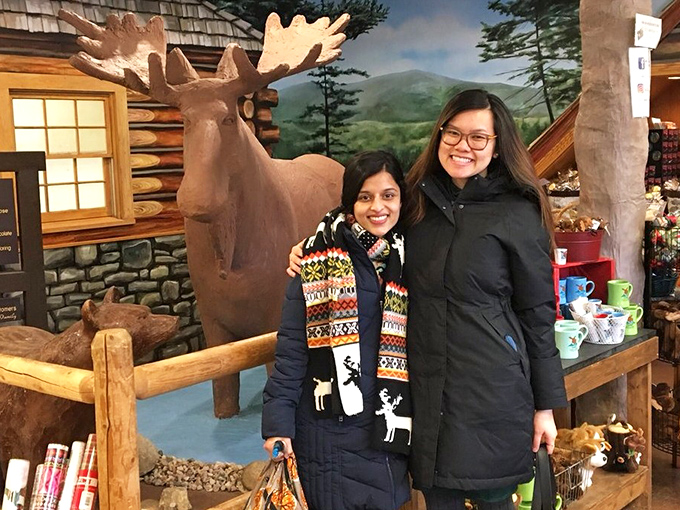 Visitors pose with the chocolate wilderness scene, creating memories sweeter than the treats they'll take home.