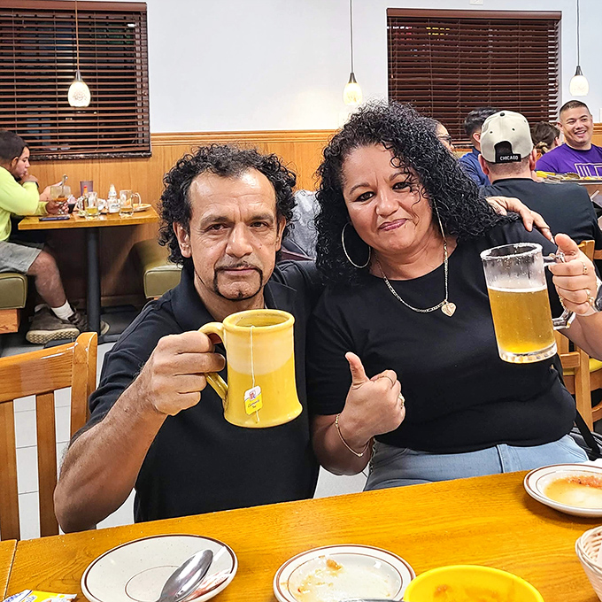 Happy diners enjoying cold beverages &ndash; the universal sign of a successful Mexican meal in progress.