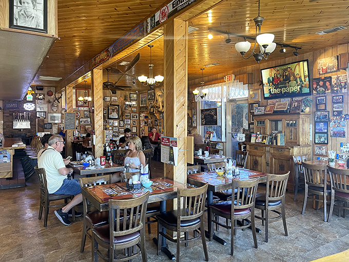 The dining area hums with conversation and clinking silverware, where wood-paneled walls display decades of Route 66 memories and memorabilia.