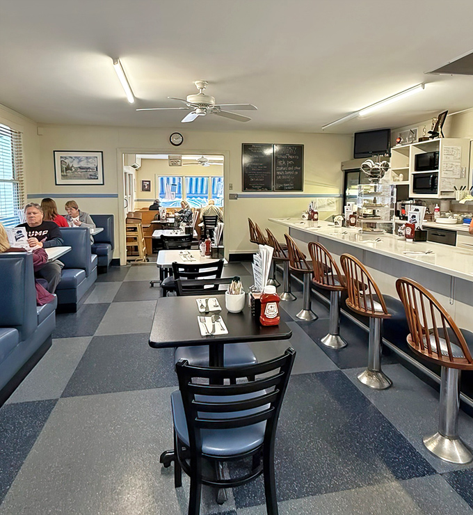 The dining area balances nostalgic diner aesthetics with comfortable seating, where conversations flow as freely as the coffee refills.