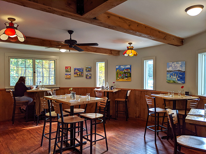 Warm wooden beams and thoughtful lighting create that rare dining atmosphere that's both spacious and intimately cozy.