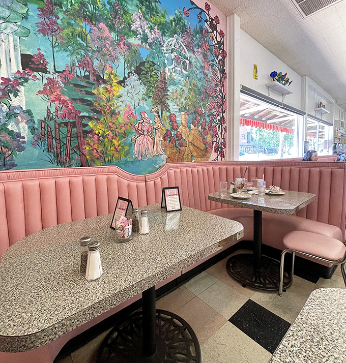 Pink booths and whimsical murals transport diners to a gentler era when sharing a sundae was the height of romance.