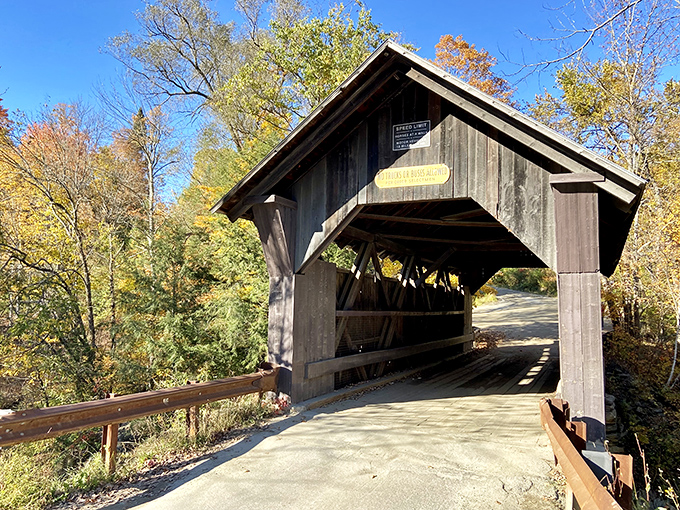 The Gold Brook Covered Bridge stands in quiet beauty, its aged timbers and shadowed corners hinting at ghostly encounters after sunset.