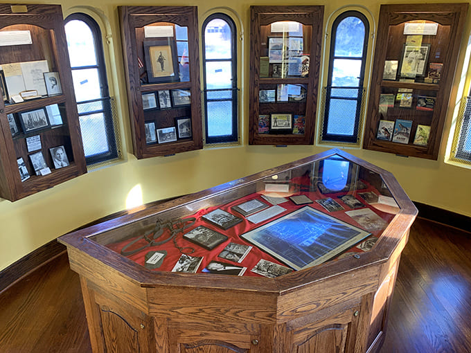 The castle's interior showcases Curwood's literary legacy through carefully preserved artifacts, each display window framing a piece of Michigan's cultural history.