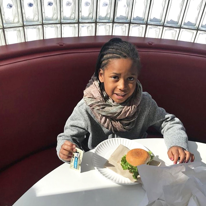 Creating smiles one bite at a time &ndash; this little one&rsquo;s burger moment is pure joy and delicious fun.