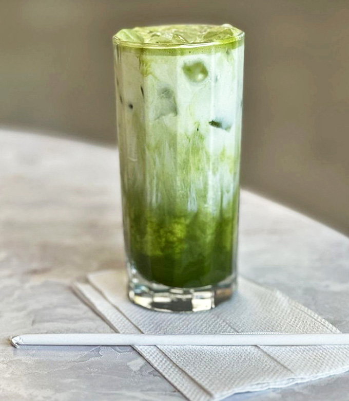 The matcha cloud drink swirls with verdant mystery &ndash; part beverage, part visual poetry, all refreshment in a tall, cool glass.