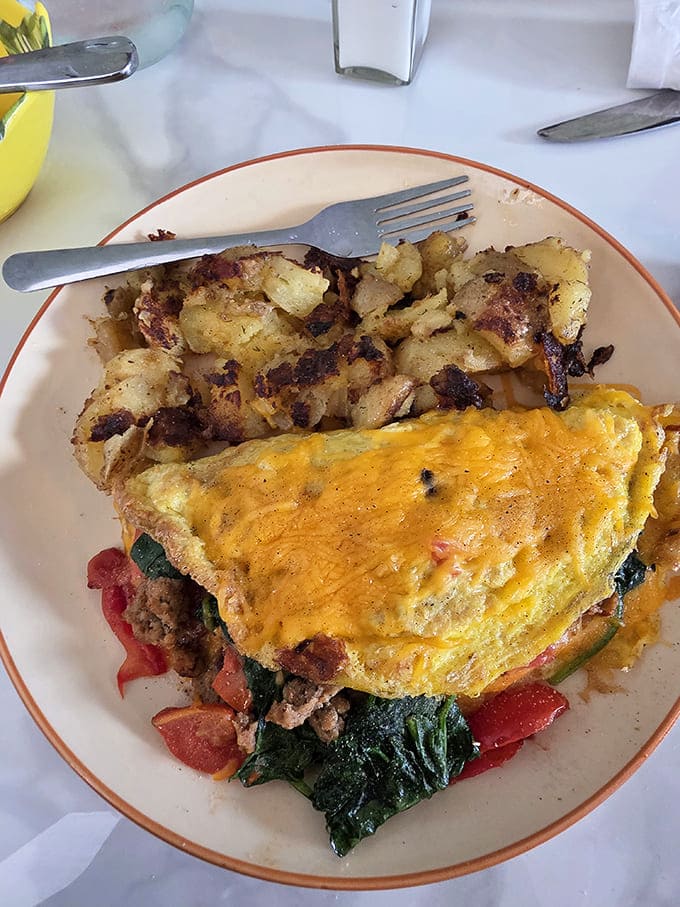 Omelet: This isn't just an omelet &ndash; it's a carefully crafted envelope of egg delivering cheesy, veggie-filled messages to your taste buds.