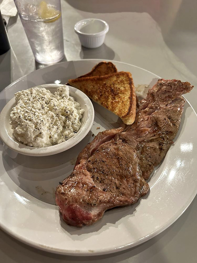 A hearty steak with potato salad &ndash; the kind of honest plate that fueled generations of Route 66 travelers before Instagram food pics were a thing.