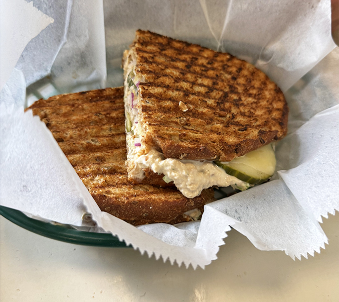 The sandwich isn't just grilled – it's been coaxed to golden perfection, with fillings that whisper, "One bite and you'll be back."
