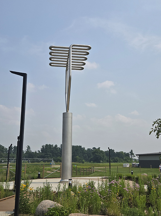 The sculpture's elegant curves and modern design demonstrate that agricultural monuments can be artistically sophisticated while remaining wonderfully absurd.