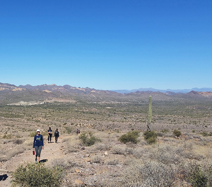 Intrepid explorers traverse the desert trails, each step revealing new perspectives of this ancient, timeless landscape.