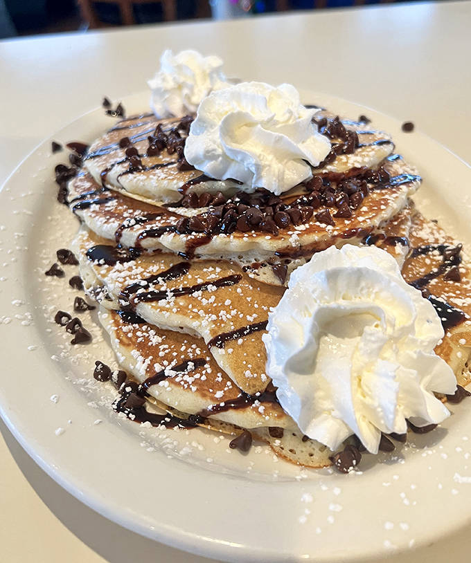 Dessert for breakfast? These chocolate chip pancakes topped with whipped cream and chocolate sauce make a compelling argument.