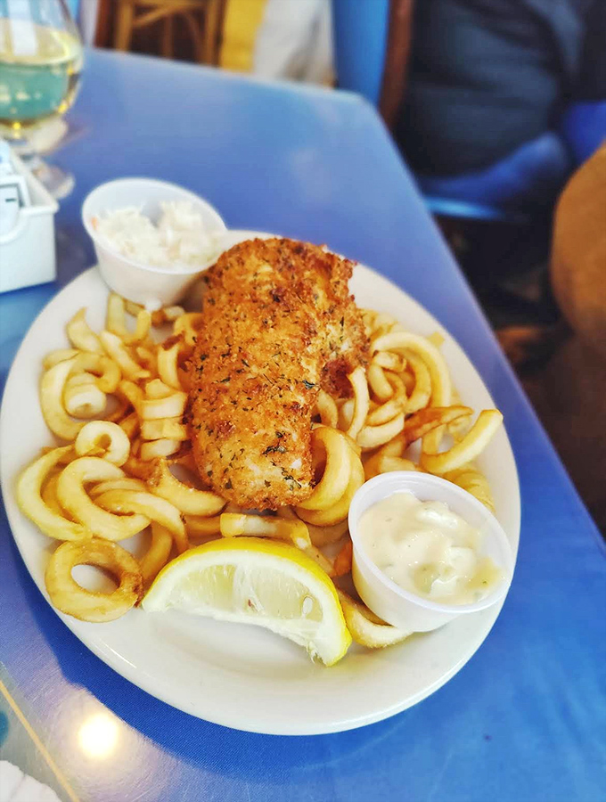 Golden-battered fish atop a mountain of fries &ndash; proof that simplicity, when executed perfectly, beats complexity every time.