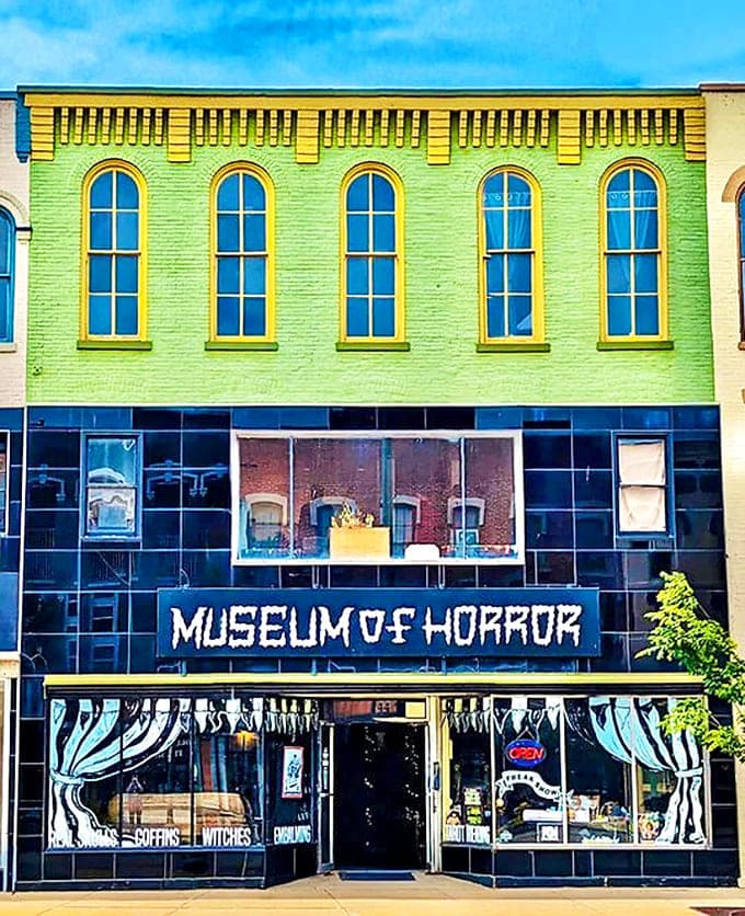 The Michigan Museum of Horror's vibrant lime green facade and spooky window displays promise chills and thrills for brave visitors.