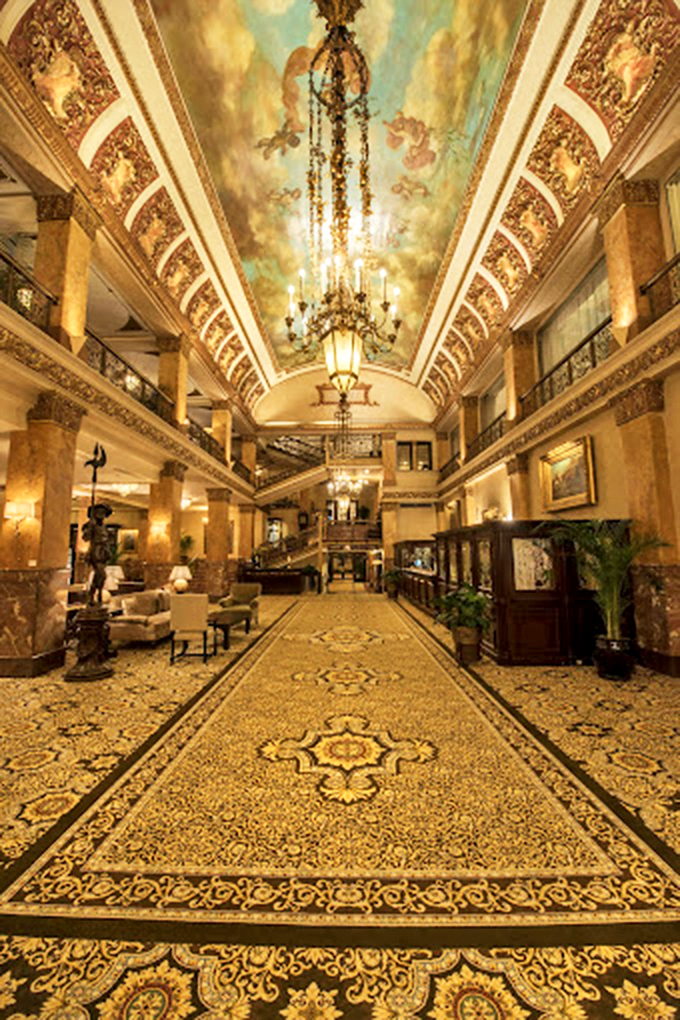 Chandeliers, cherubs, and possibly Charles Pfister himself! This lobby's got more character than a Dickens novel.