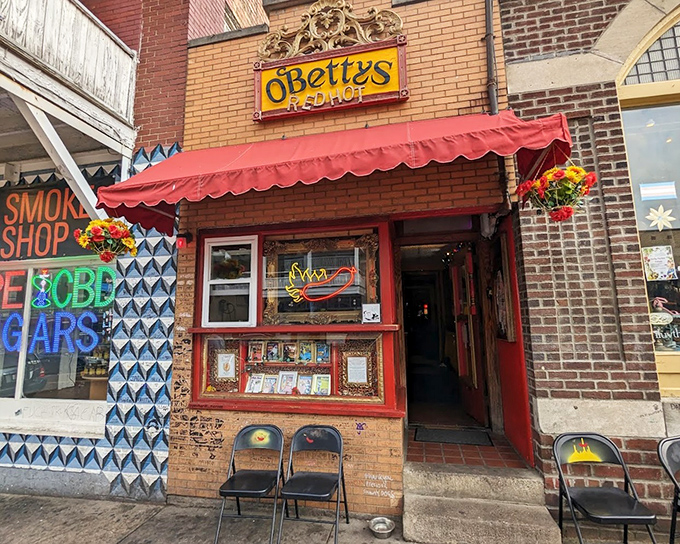 The vintage sign and colorful storefront of O'Betty's Red Hot stands out on Athens' brick-lined street. This hot dog haven doubles as a museum celebrating America's favorite handheld meal.