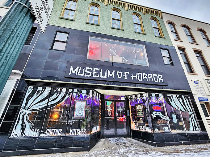 Even in daylight, the Michigan Museum of Horror's storefront with its painted curtains and eerie displays sets the stage for spine-tingling exhibits inside.