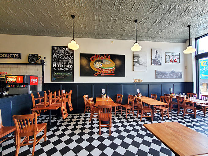 The dining room's warm ambiance invites lingering conversations over endless coffee refills &ndash; notice the pressed tin ceiling adding vintage charm overhead.
