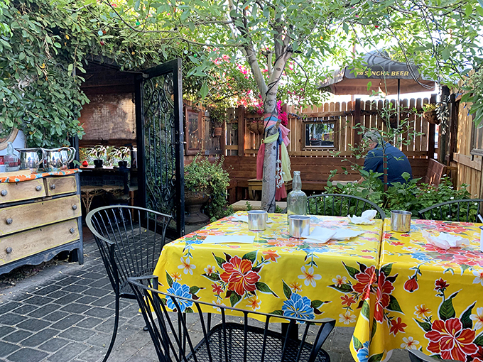 Step into Glai Baan's enchanting outdoor patio, where vibrant tablecloths and lush greenery transport you to a Thai oasis in the heart of Phoenix.