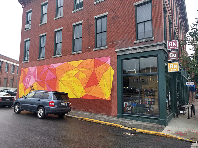Welcome to the Technicolor dreamcoat of bookstores! This vibrant mural isn't just eye candy&mdash;it's a portal to literary adventures and caffeinated bliss.
