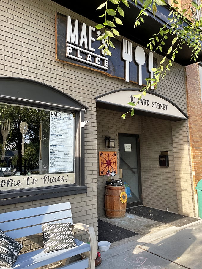 Welcome to breakfast paradise! Mae's Place beckons with its charming brick facade and promise of culinary delights.