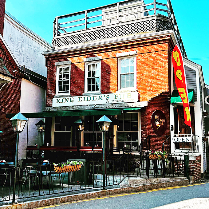 A brick-and-mortar love letter to seafood lovers! King Eider's Pub stands proud, its red facade as inviting as a lighthouse to hungry sailors.