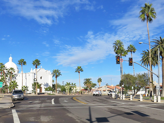 Welcome to Ajo, where the desert meets Mediterranean charm! Palm trees and a white-domed church create an unexpected oasis in the heart of Arizona's Sonoran landscape. Photo credit: courthouselover