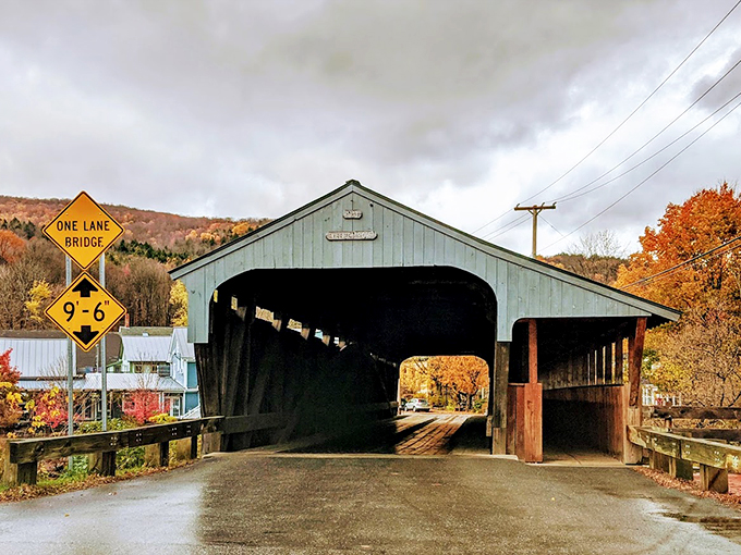 Step right up to Vermont's time machine! This sage-green giant has been playing bridge with the Mad River since 1833, and it's still dealing a winning hand.