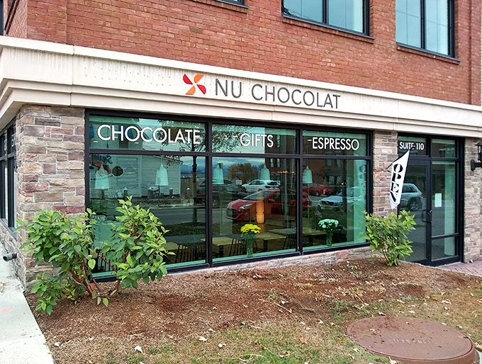 Welcome to chocolate heaven! NU Chocolat's storefront promises a world of cocoa-coated delights, just waiting to tantalize your taste buds.
