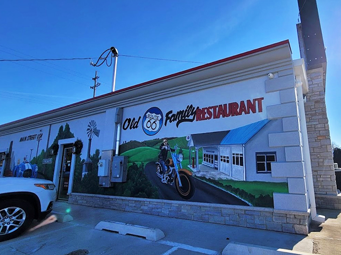 The classic white-and-red exterior with its Route 66 mural welcomes travelers like a beacon of comfort food hope.