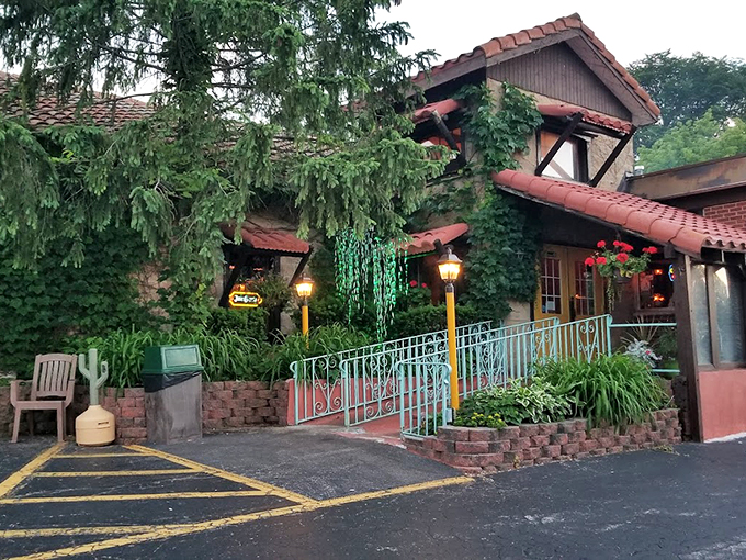 A storybook hacienda wrapped in ivy and warmth, El Molino's entrance feels like stepping into a secret garden where Mexican cuisine awaits.