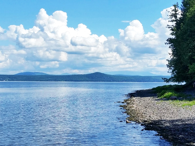 Nature's infinity pool: Lake Champlain stretches to the horizon, a mirror for clouds playing hide-and-seek with the mountains.