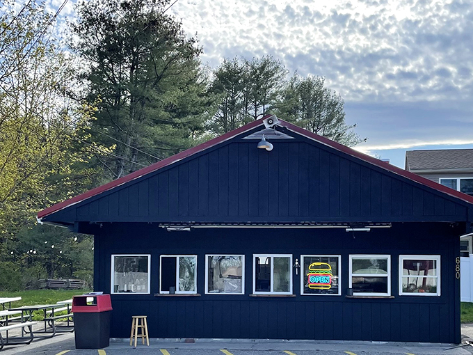 A cozy navy-blue cabin in the Maine woods serves up burger perfection. Those picnic tables are calling your name!