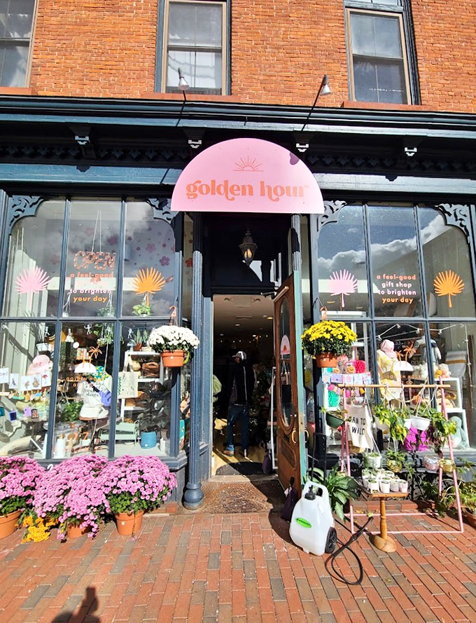 Step into a world of whimsy! Golden Hour Gift Co's charming storefront beckons with vibrant flowers and an eclectic window display that promises treasures within.