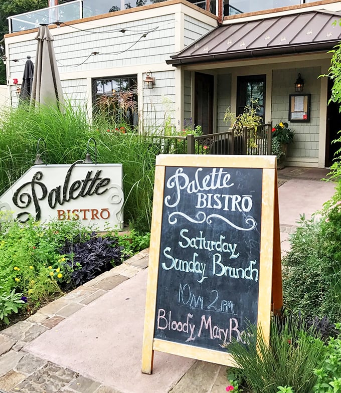A charming coastal welcome awaits, with ornamental grasses dancing in the breeze and a chalkboard promising weekend brunch delights.