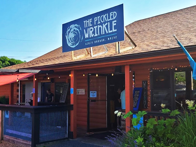 A welcoming coral-colored haven in Birch Harbor, where twinkling string lights and coastal charm invite you to stay awhile.