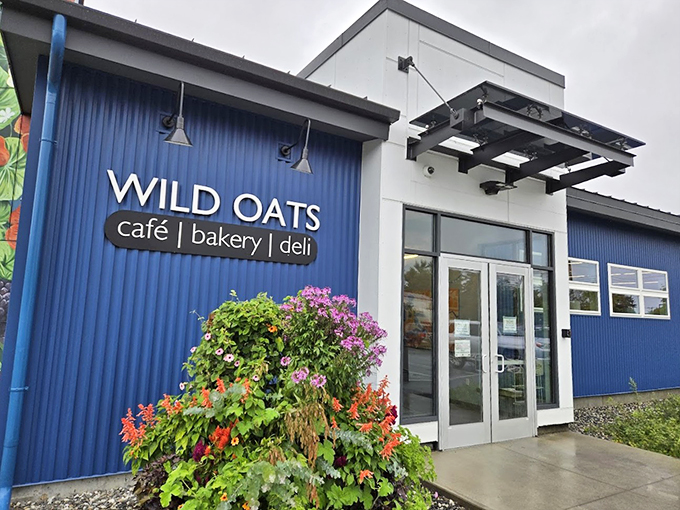 The vibrant blue exterior and blooming flowers welcome you like a warm Maine hug, proving great things come in charming packages.