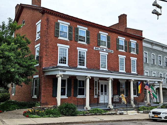 A stately brick building with stories to tell - the Henry Sheldon Museum stands proudly on Park Street, its green shutters winking at passersby.