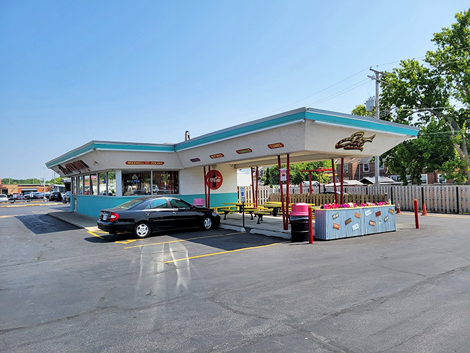 This turquoise-trimmed time capsule of taste stands ready to serve, complete with vintage charm and picnic tables perfect for summer evenings.