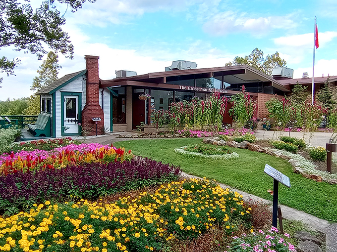 Welcome to the Warther wonderland! This charming museum entrance is like stepping into a train enthusiast's dream garden.
